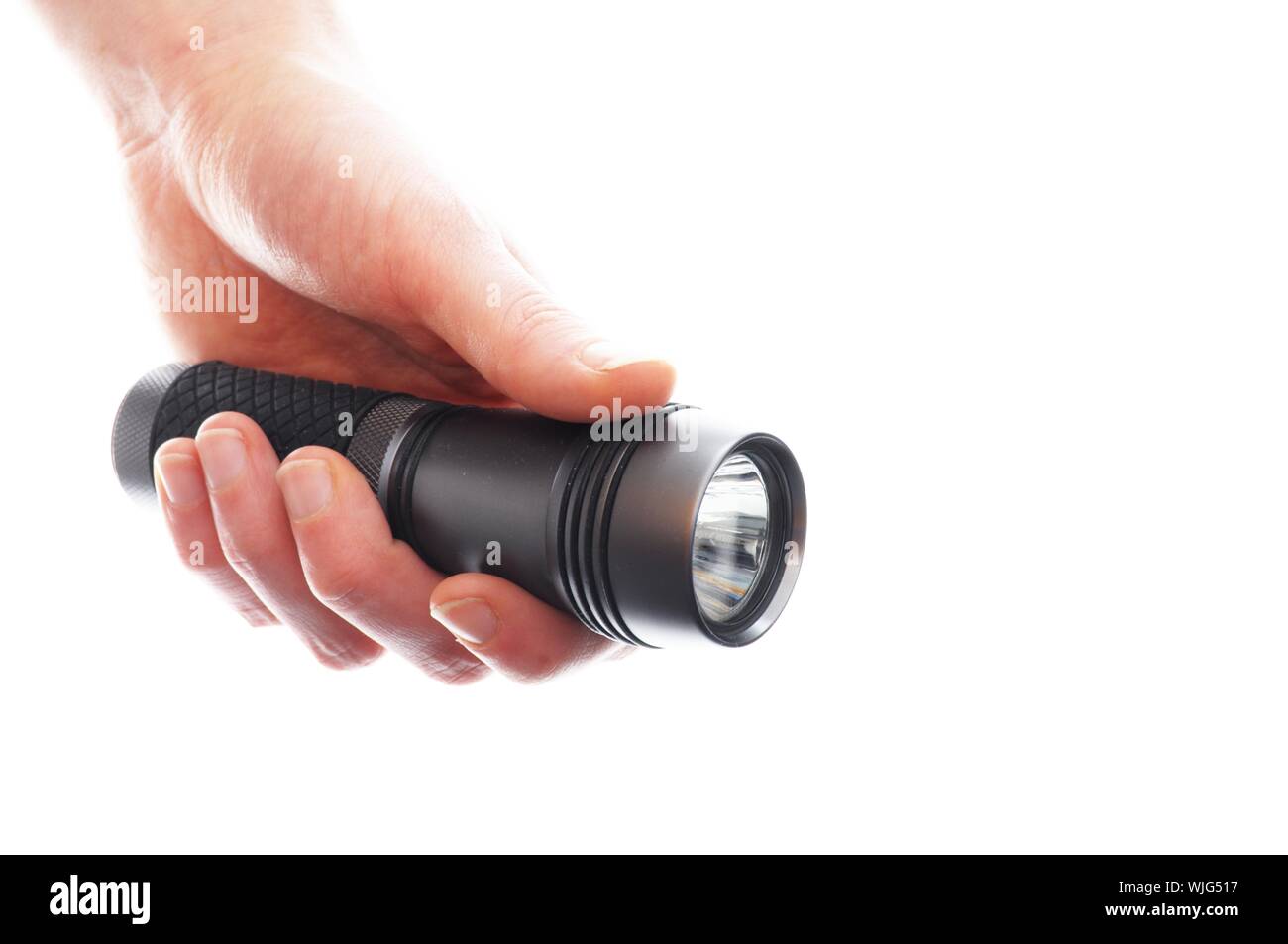 hand holding flashlight isolated on a white background Stock Photo - Alamy