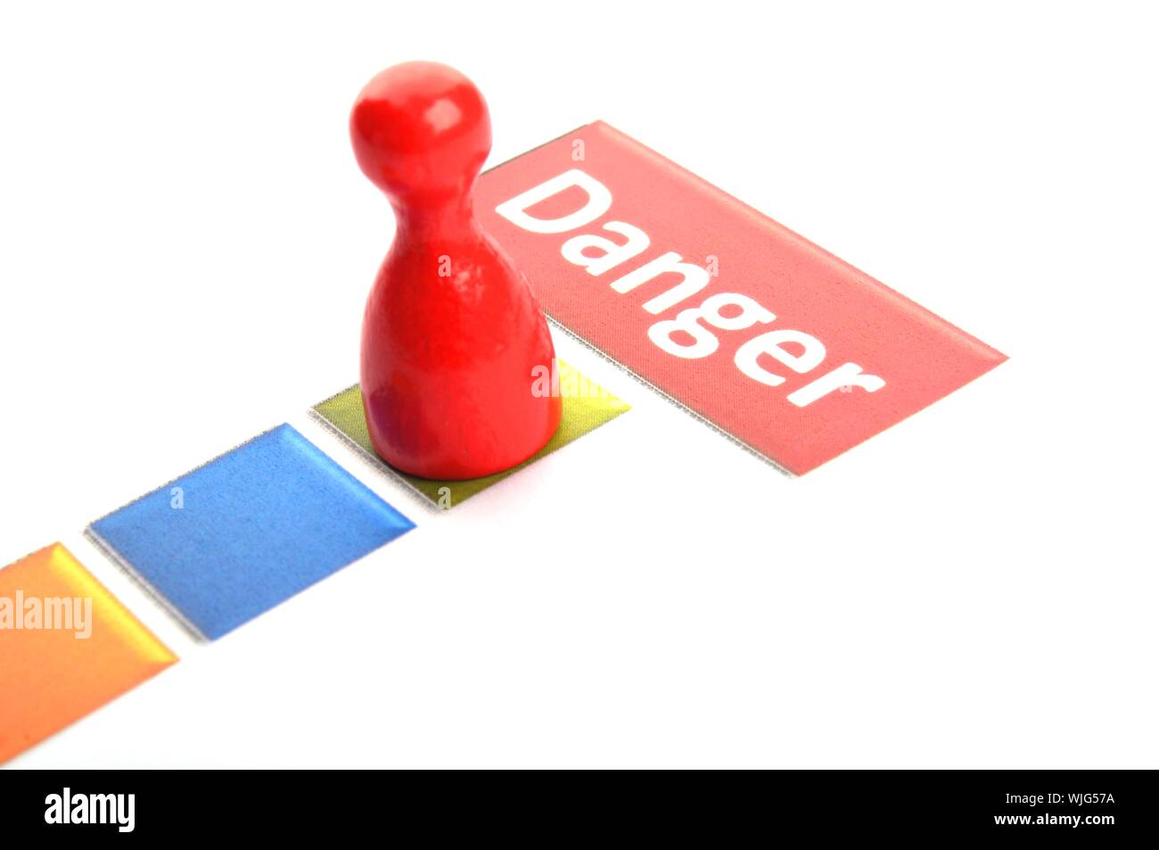 danger or risk ahead concept with pawn in white Stock Photo - Alamy