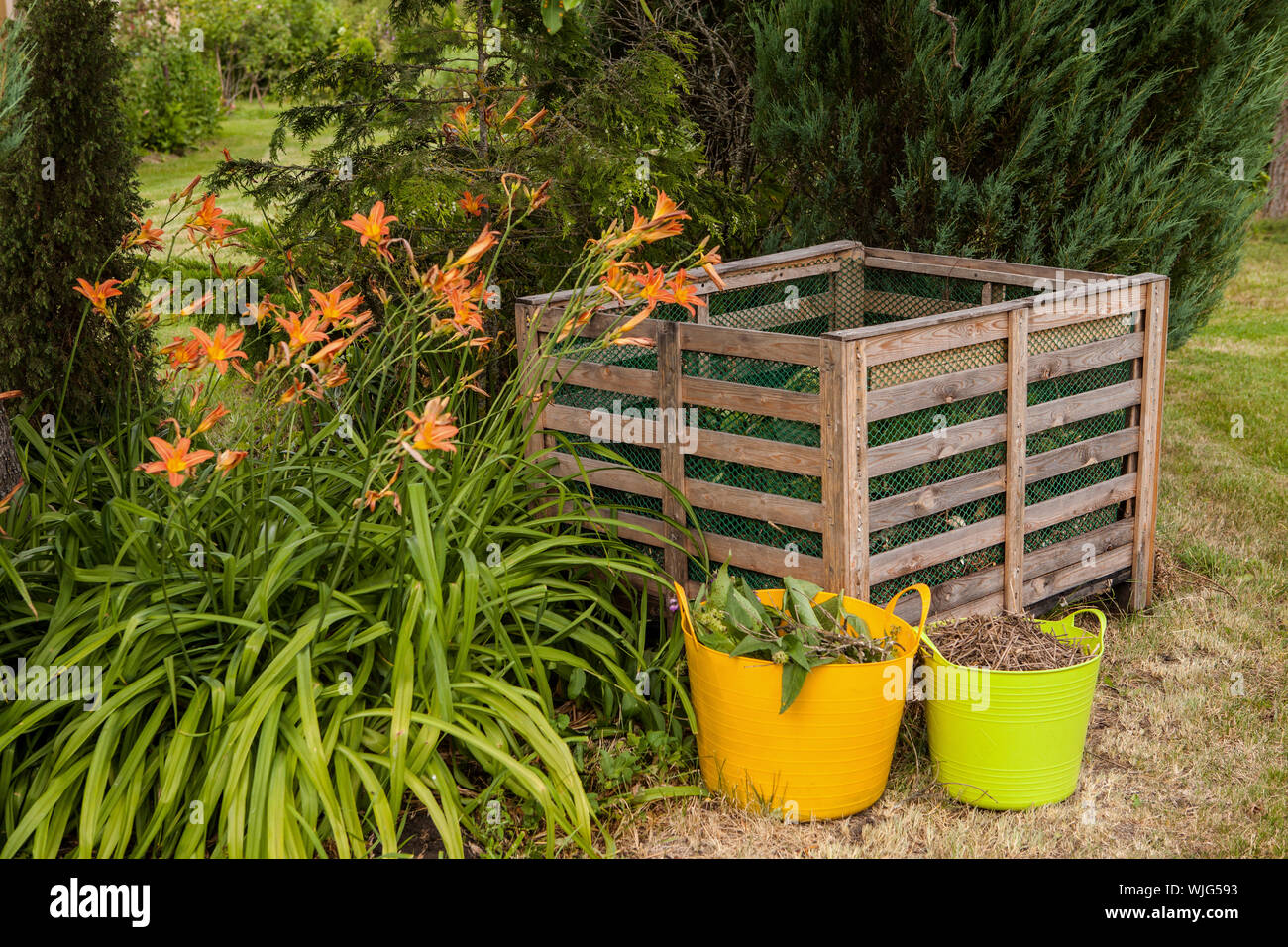 Compost bin in summer garden Stock Photo - Alamy