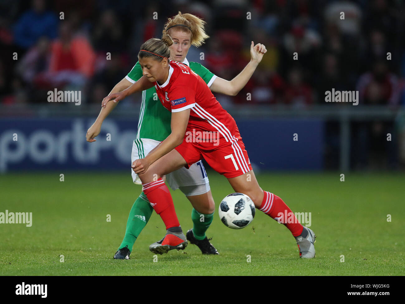 Wales' Emma Jones is tackled by Northern Ireland's Rachel Furness ...