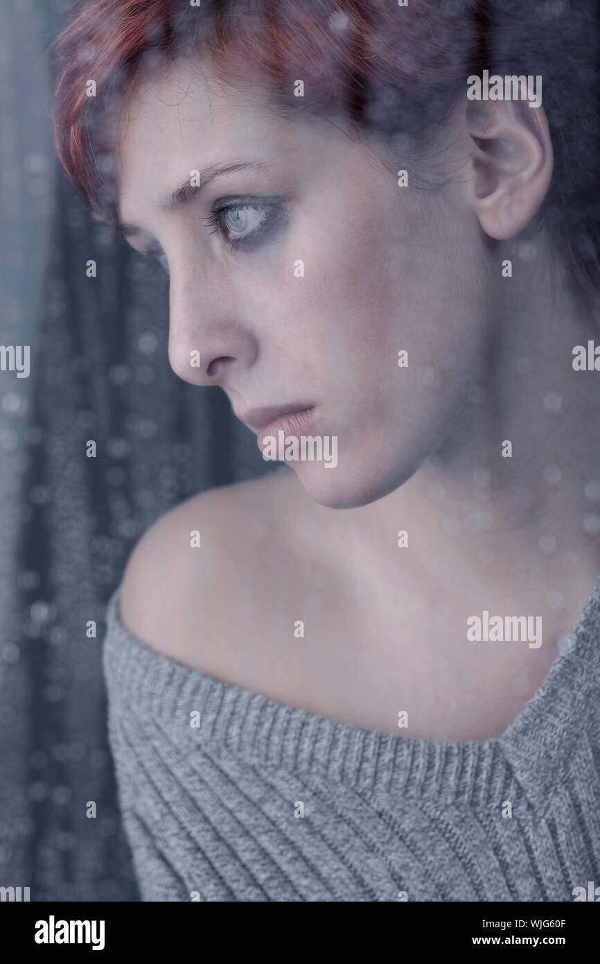 beautiful sad woman behind window at a rainy day Stock Photo - Alamy