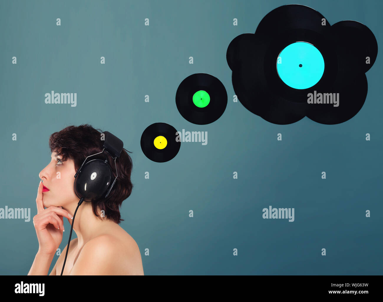 young woman thinking about music with vinyl record thinking balloons ...