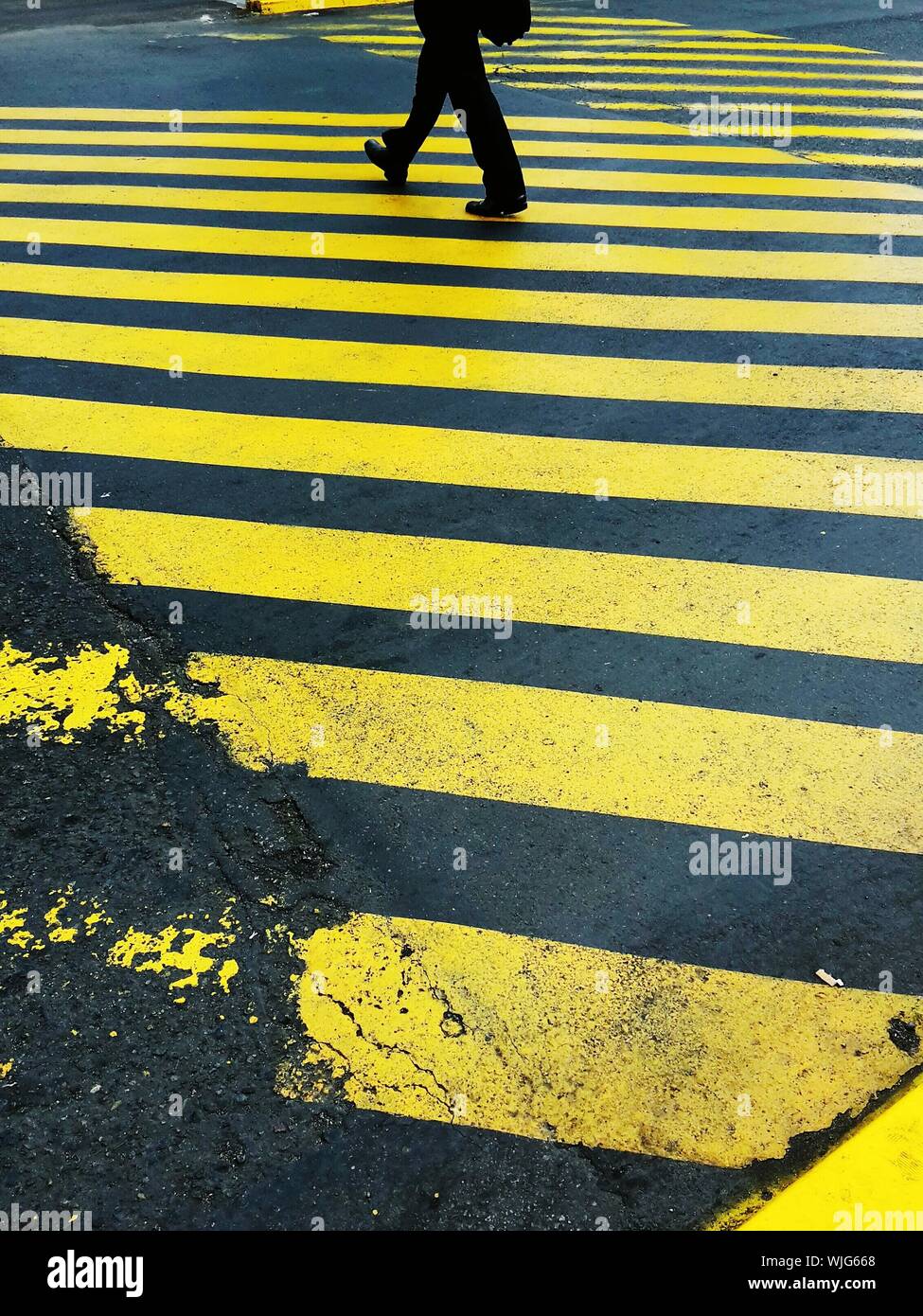 Yellow man walking hi-res stock photography and images - Alamy