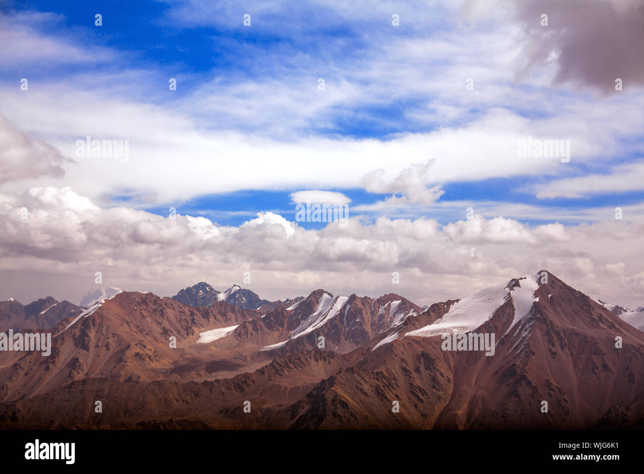 Tian Shan mountain peaks at sunrise. Melting glaciers in a Global ...