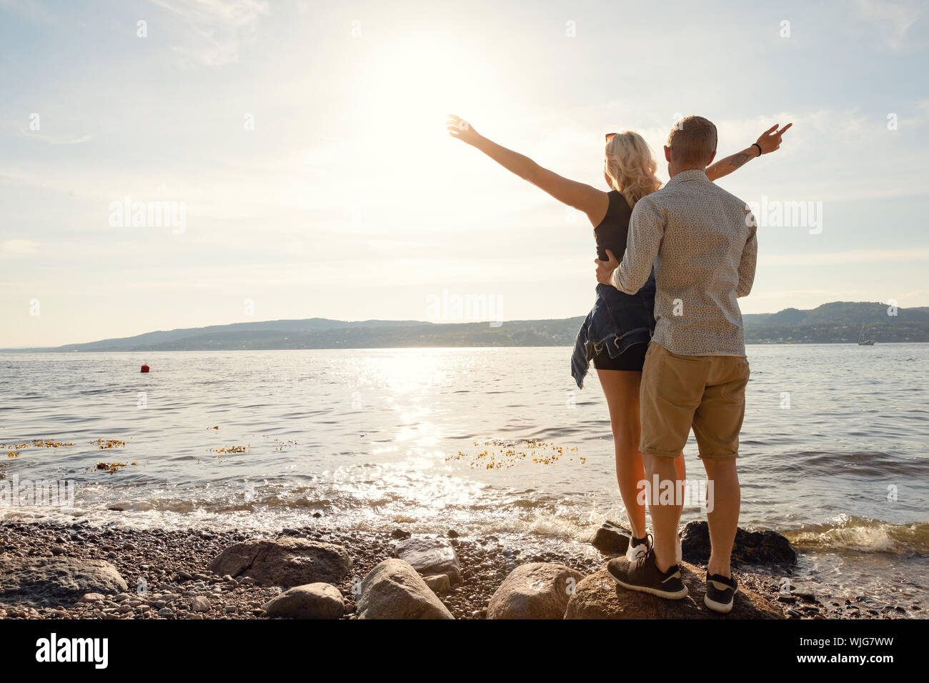 Man standing behind woman hi-res stock photography and images - Alamy