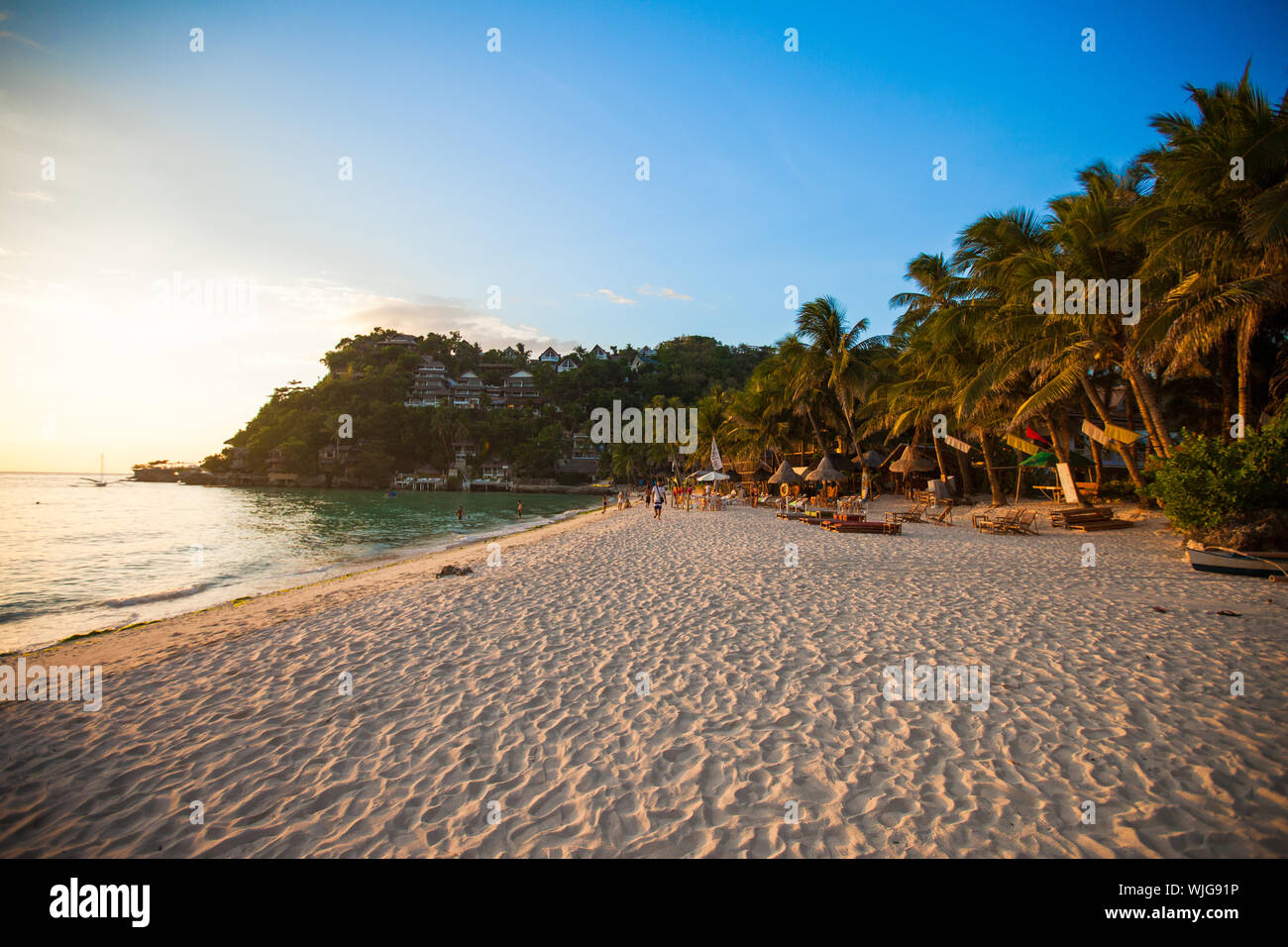 Tropical beach at sunset on an exotic island Stock Photo - Alamy