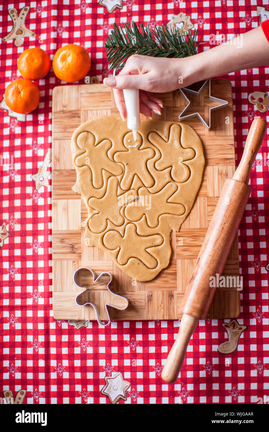 Hands making from dough Christmas gingerbread man Stock Photo - Alamy