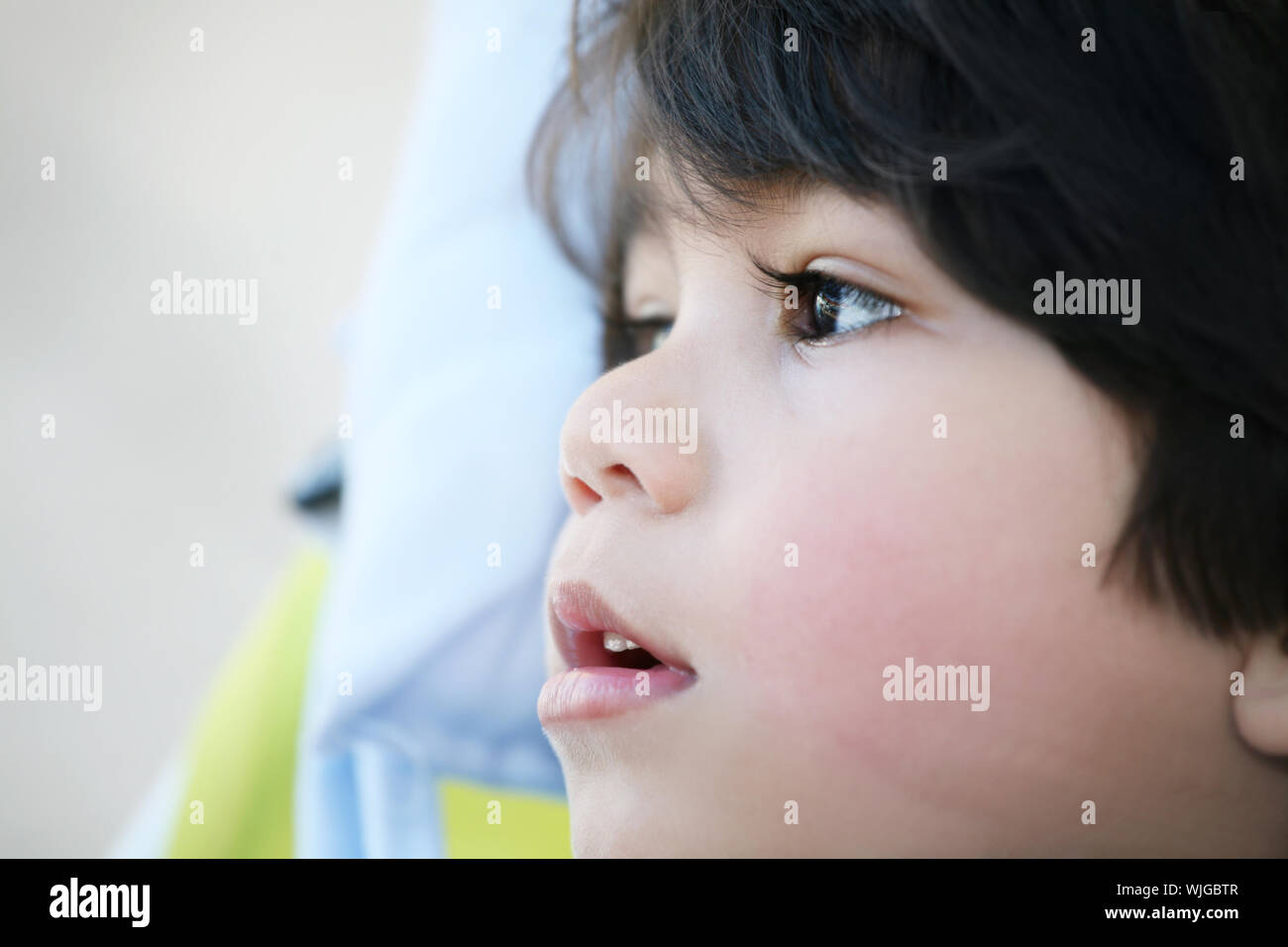 Handsome toddler boy profile, looking off to side Stock Photo - Alamy