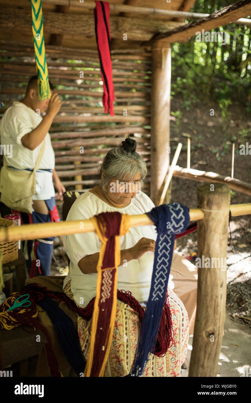 CHEROKEE, USA-JUNE 17, 2017: Unidentified Cherokee woman makes cloth in ...