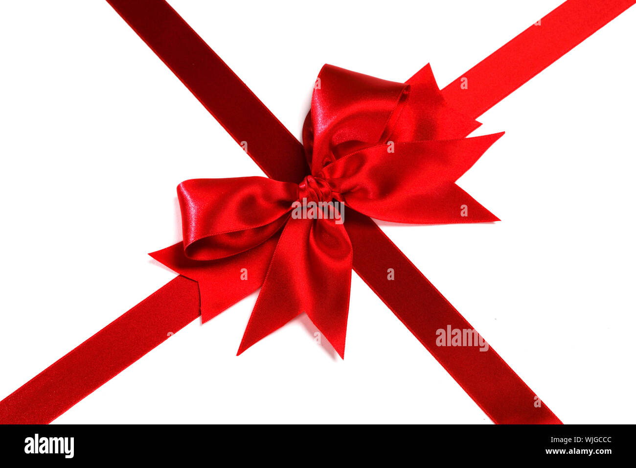 Shiny red satin bow isolated on white background Stock Photo - Alamy