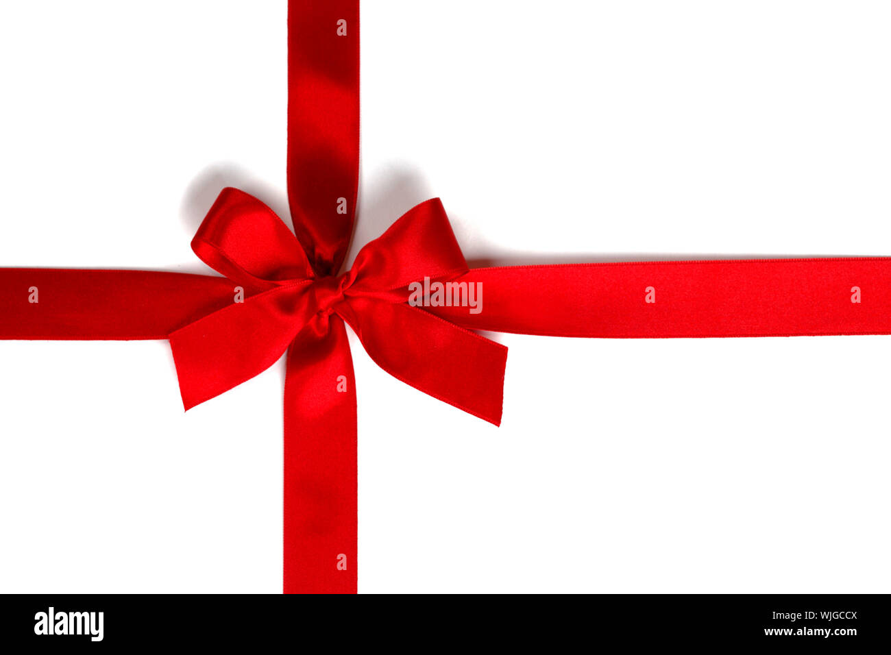 Red ribbon with bow isolated on white background Stock Photo - Alamy