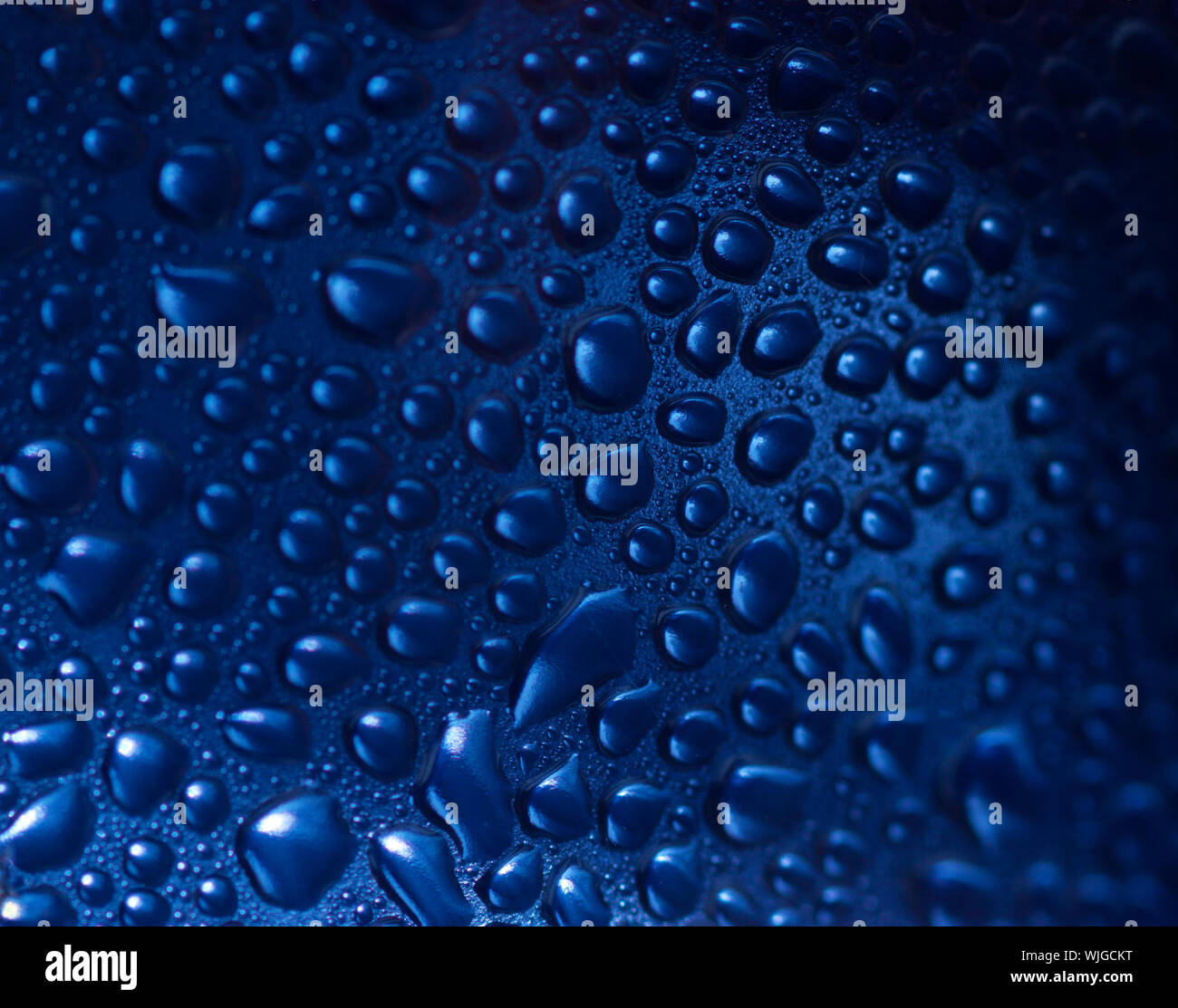 Blue abstract background. Condensate drops on a curved surface Stock ...