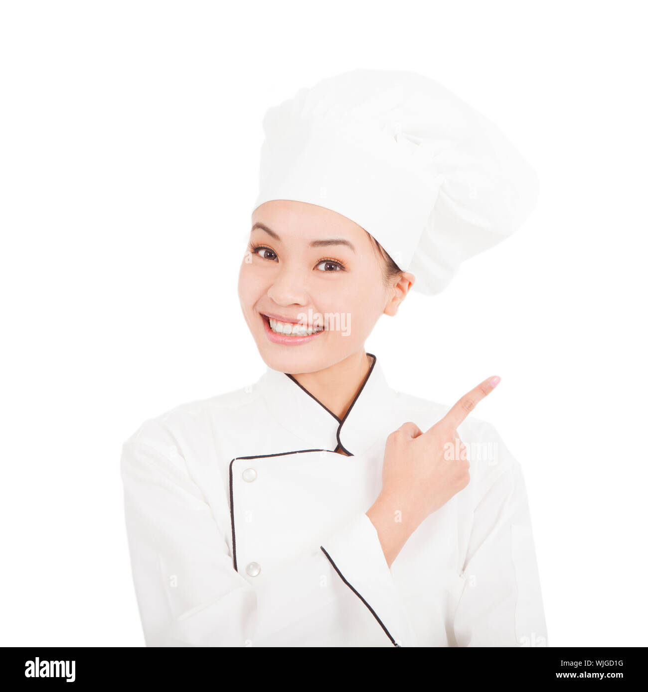 Asian young woman chef pointing direction Stock Photo - Alamy
