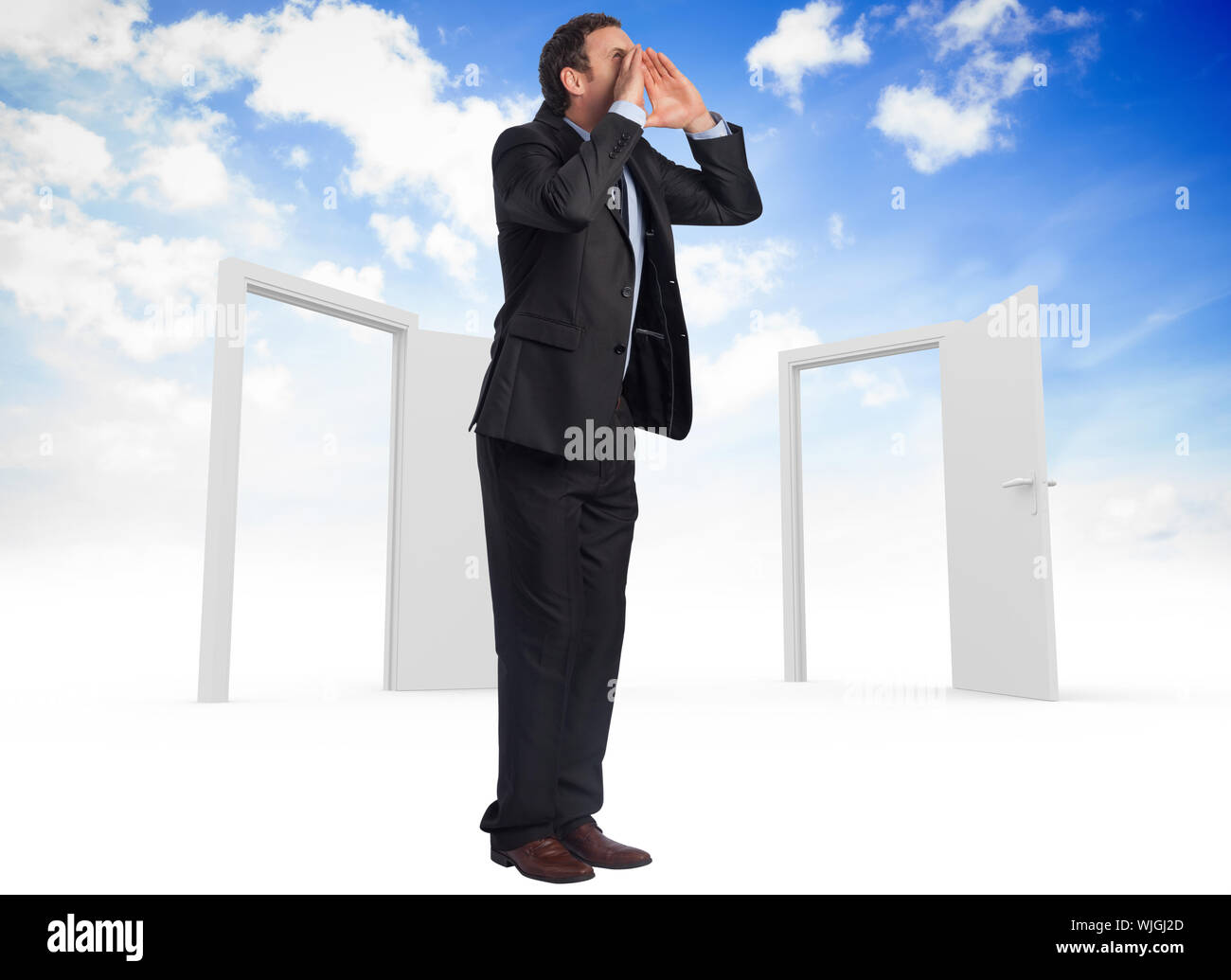 Shouting businessman against door opening Stock Photo - Alamy