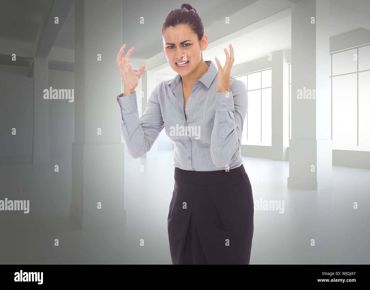 Businesswoman shouting against grey room with arrow door Stock Photo ...