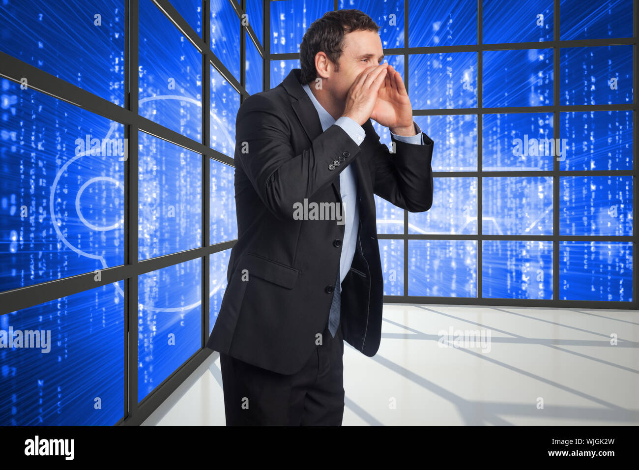 Shouting businessman against glowing key seen through window Stock Photo - Alamy