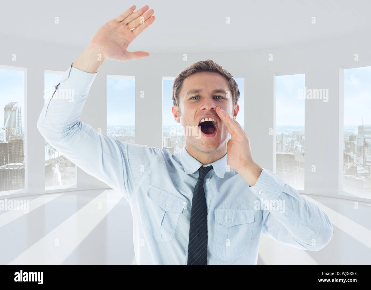 Businessman shouting and waving against bright white room with windows ...