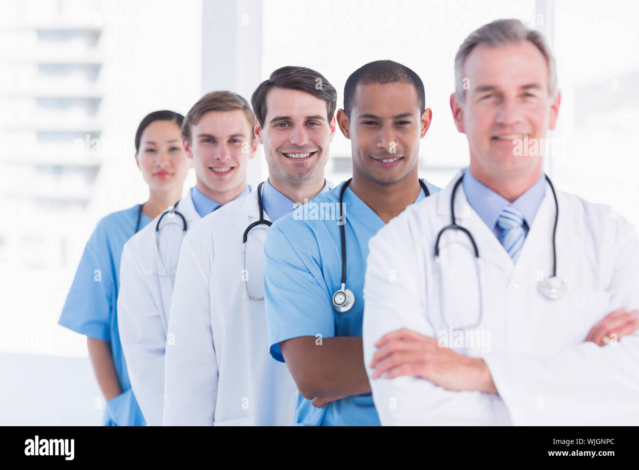 Group portrait of doctors standing in a row at the hospital Stock Photo ...