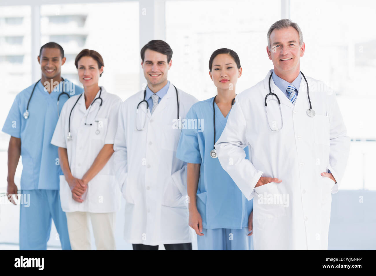 Group portrait of doctors standing in a row at the hospital Stock Photo ...