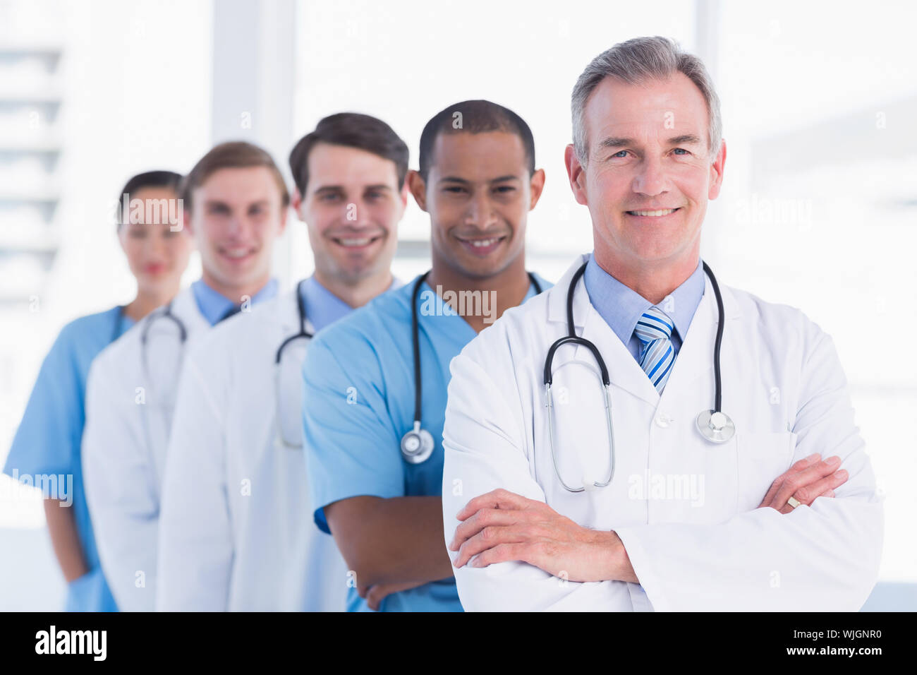 Group portrait of doctors standing in a row at the hospital Stock Photo ...