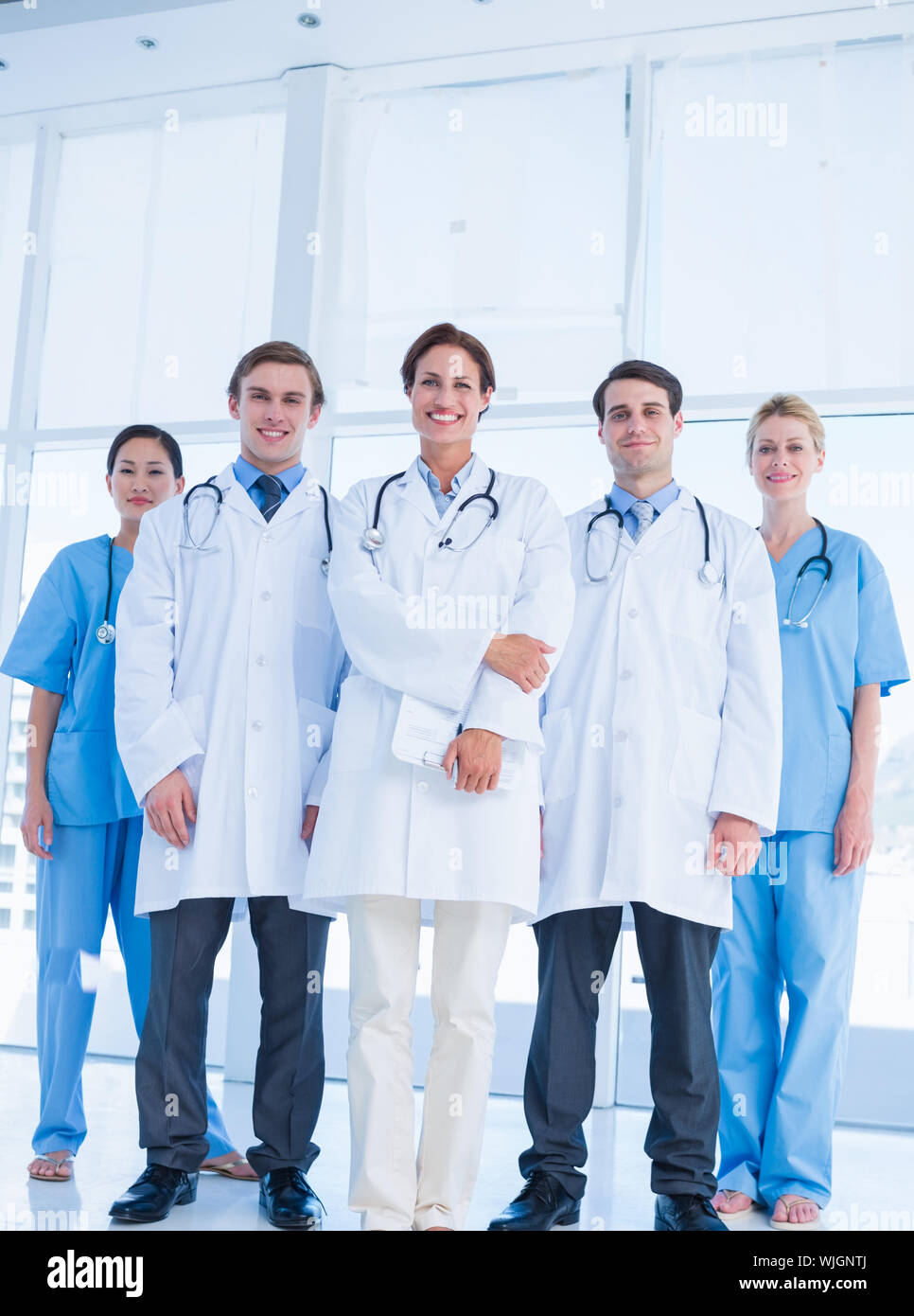 Group portrait of young doctors standing together at the hospital Stock Photo - Alamy