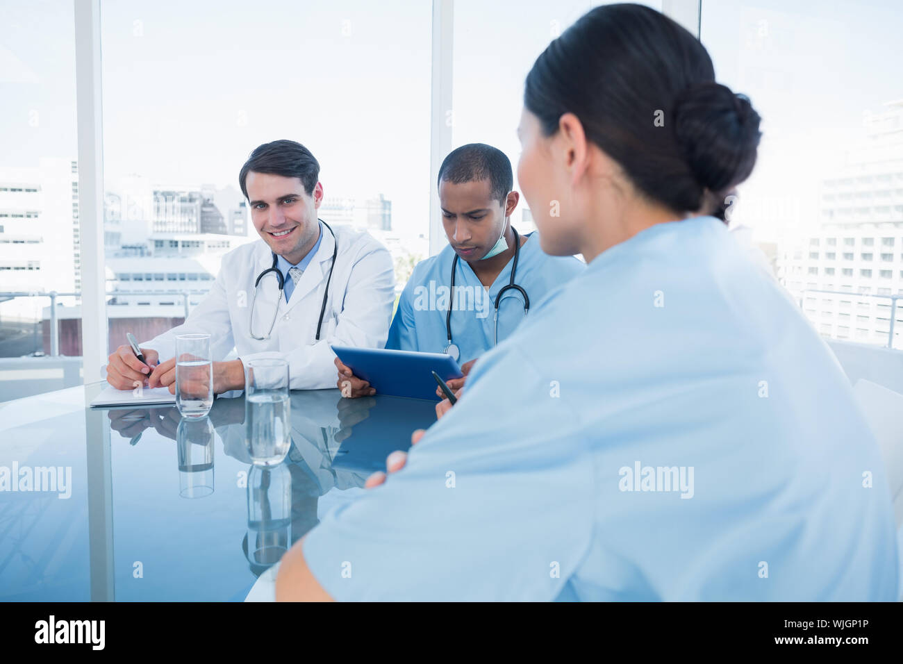 Group portrait of young doctors in a meeting at hospital Stock Photo ...