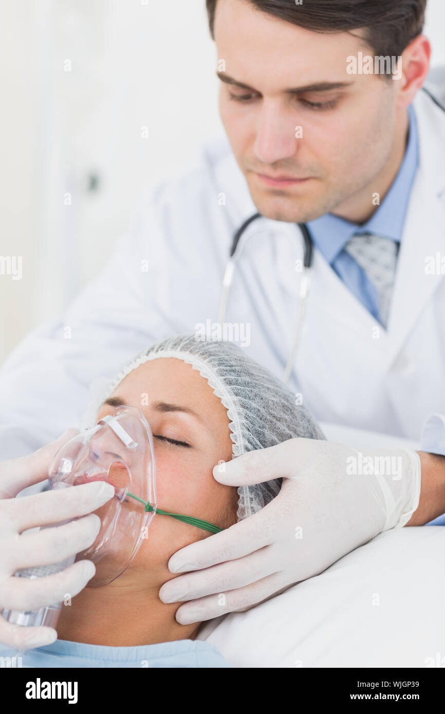 Young female patient receiving artificial ventilation in the hospital ...