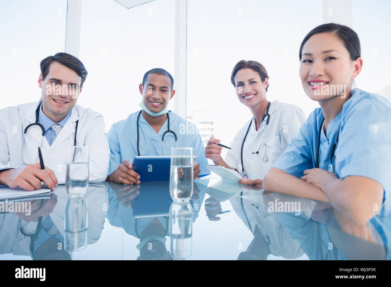 Group portrait of young doctors in a meeting at hospital Stock Photo ...