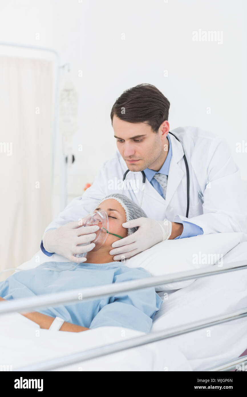 Young female patient receiving artificial ventilation in the hospital ...