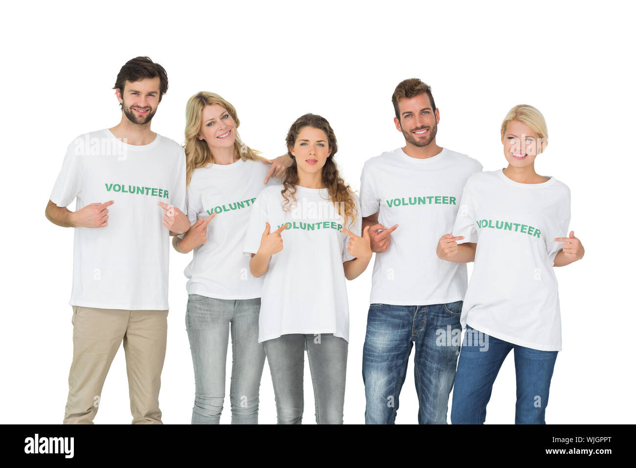 Group portrait of happy volunteers pointing to themselves over white ...