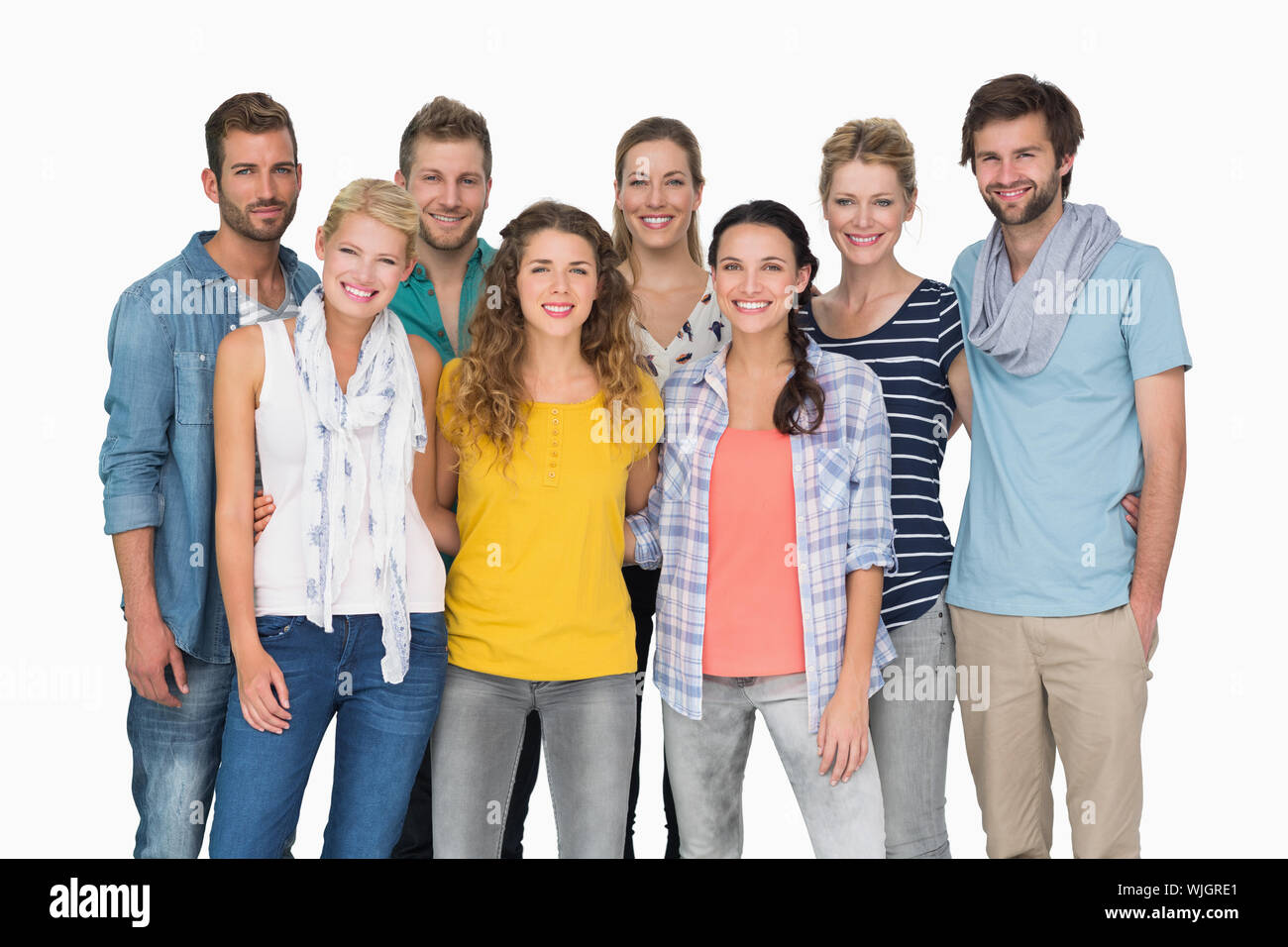 Group portrait of casual happy people standing over white background ...