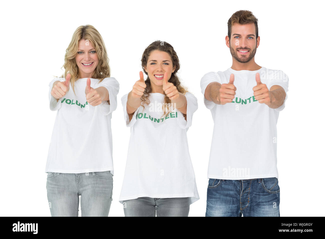 Portrait of happy three volunteers gesturing thumbs up over white ...