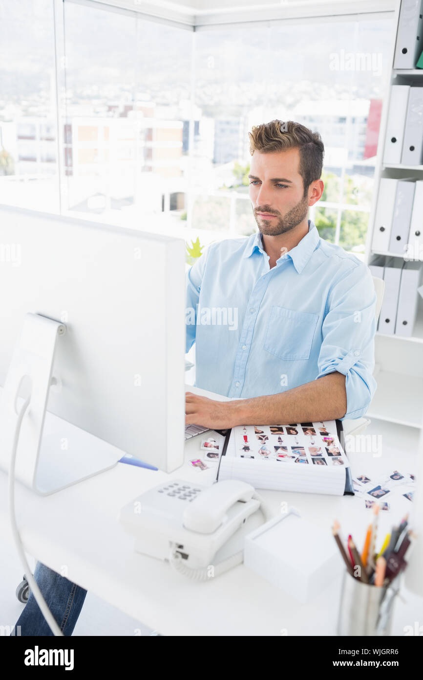 Focused male photo editor hi-res stock photography and images - Alamy