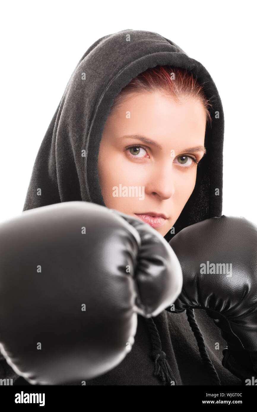 Close up shot of a beautiful young female boxer with a hoodie and ...