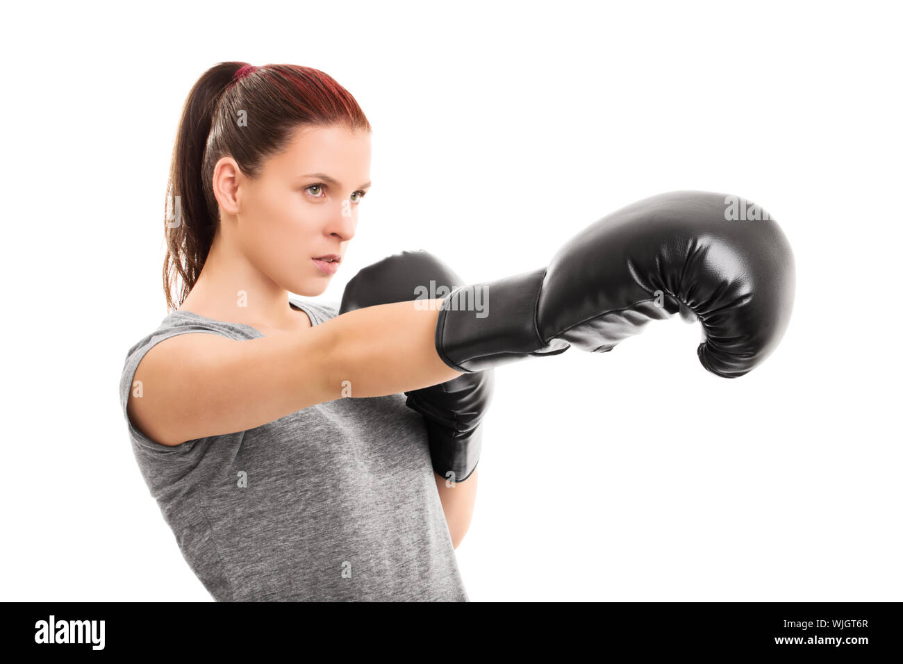 Close up shot of a beautiful young female boxer with boxing gloves ...