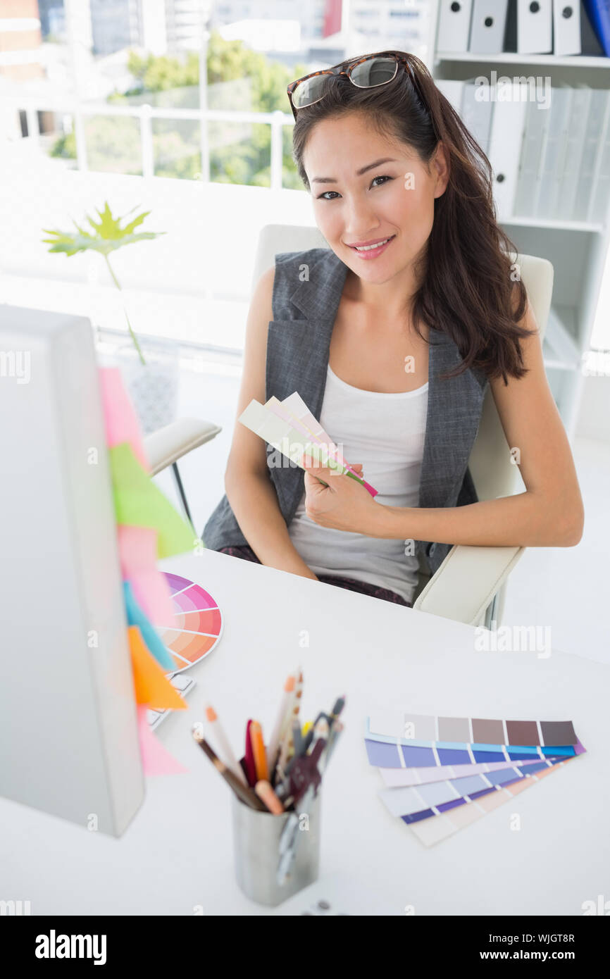 Portrait of a female photo editor at work in a bright office Stock ...
