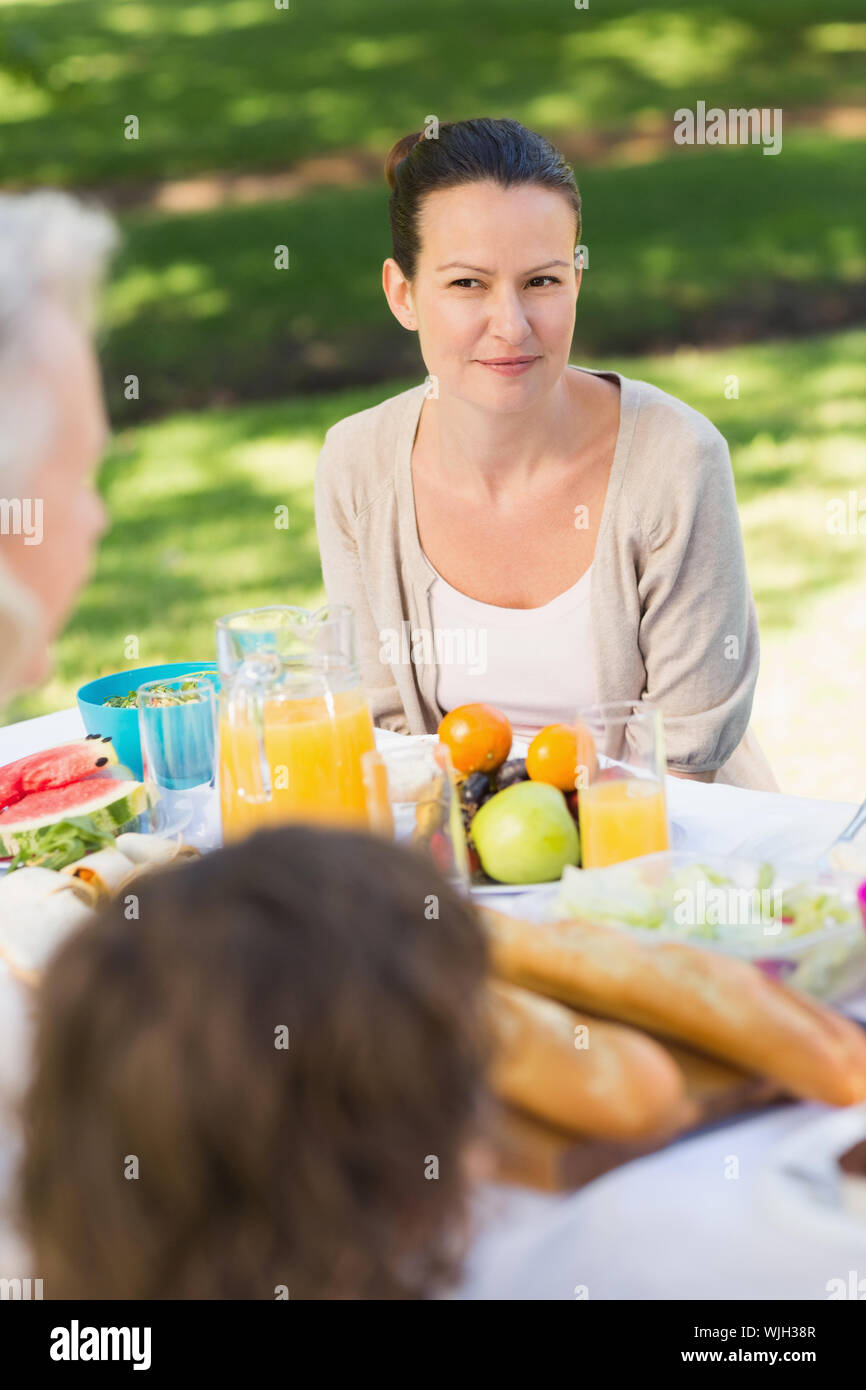 Young woman sitting outdoor dining table hi-res stock photography and ...