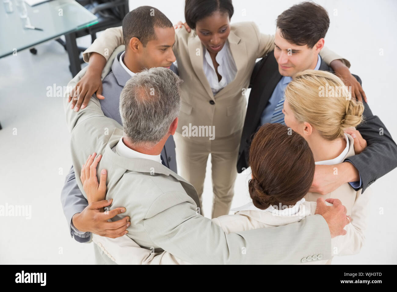 Team hugging hi-res stock photography and images - Alamy