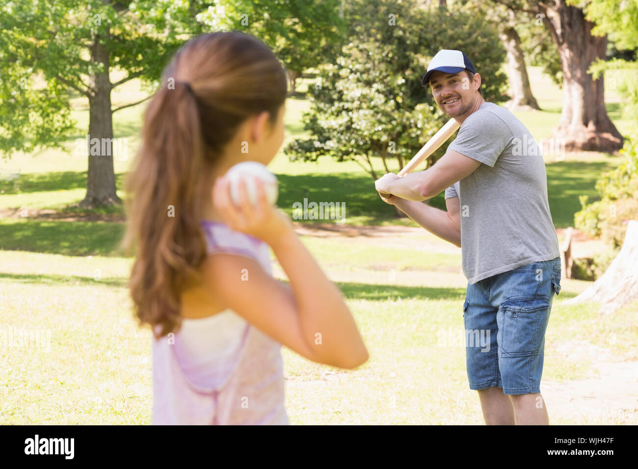 Father playing baseball with girl hi-res stock photography and images ...
