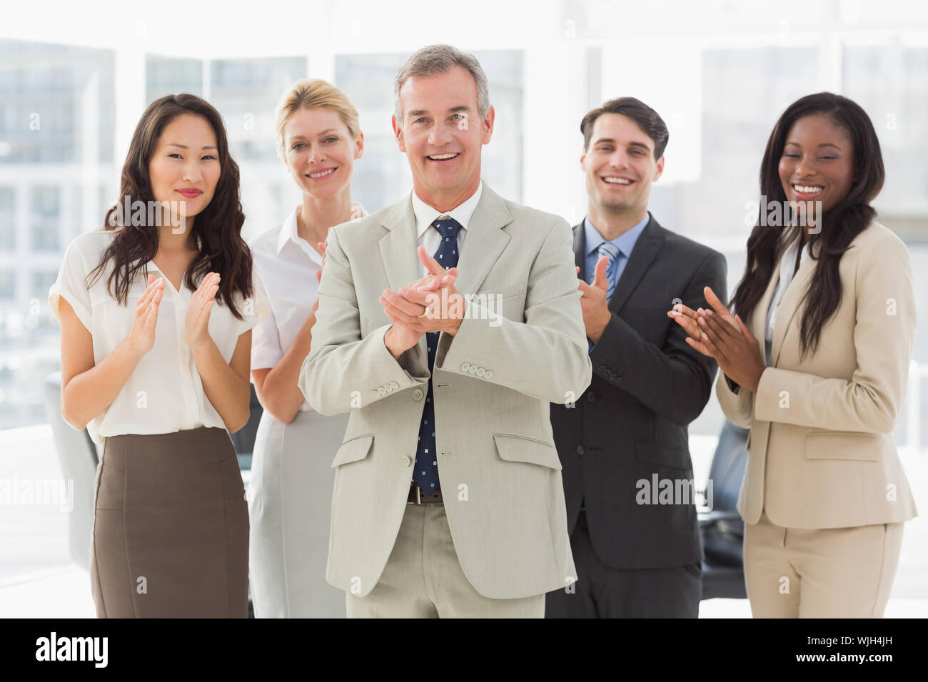 Portrait happy businessman clapping applauding hi-res stock photography ...