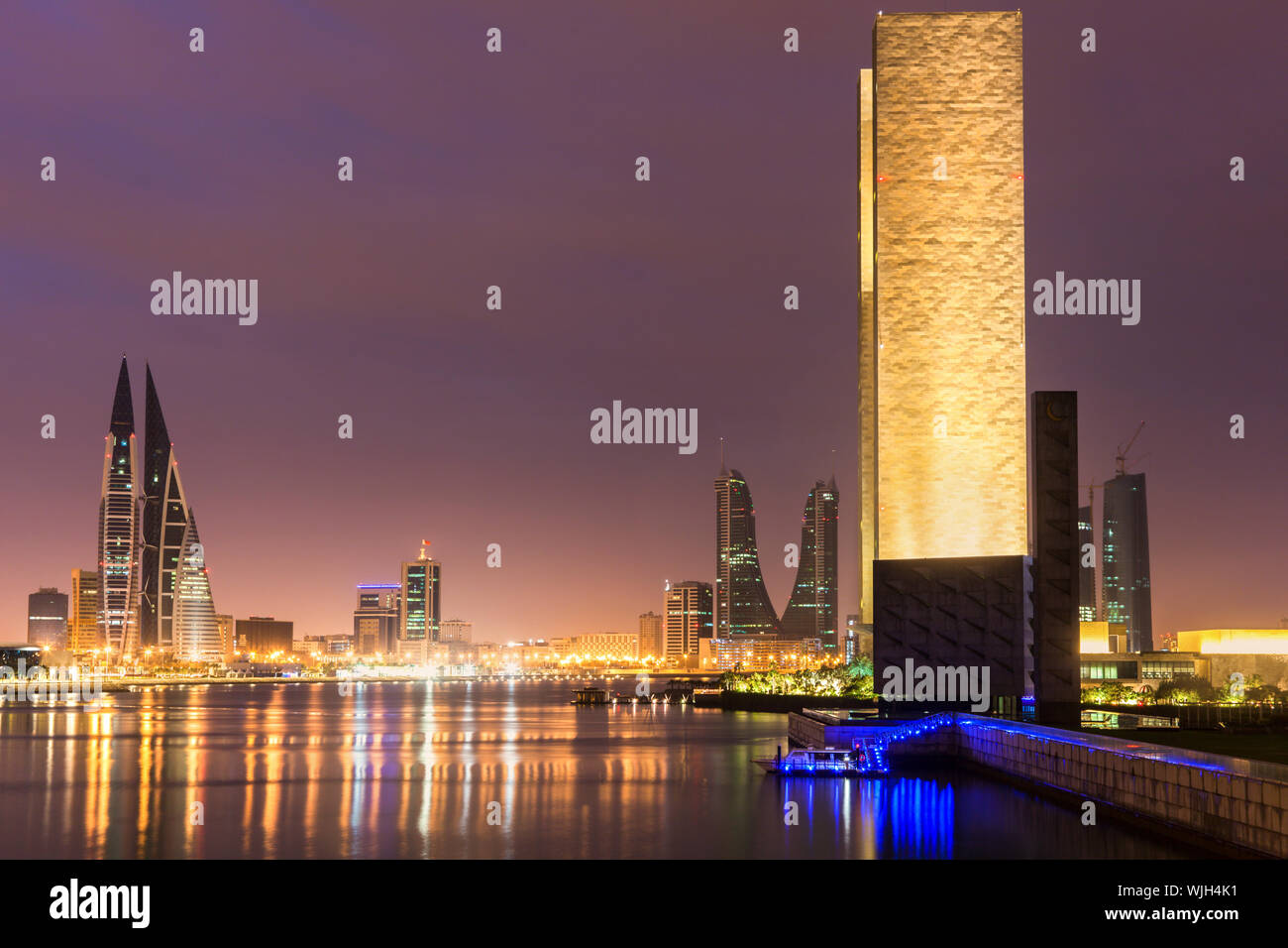 Modern architecture of Manama with the mosque in the foreground seen at ...