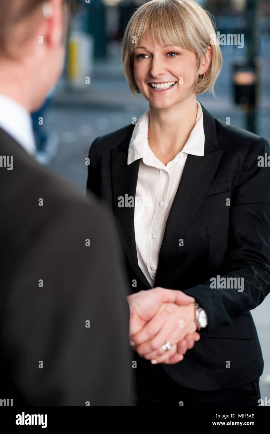 Business people shaking hands, deal finalized Stock Photo - Alamy