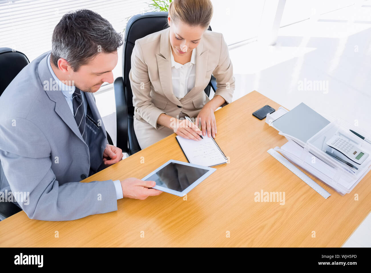 Smartly dressed business man at desk hi-res stock photography and ...