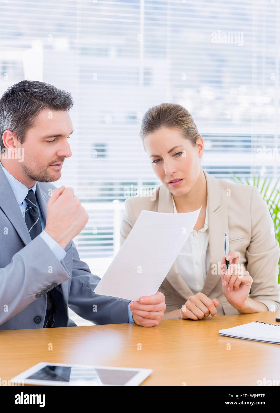Smartly dressed business man at desk hi-res stock photography and ...