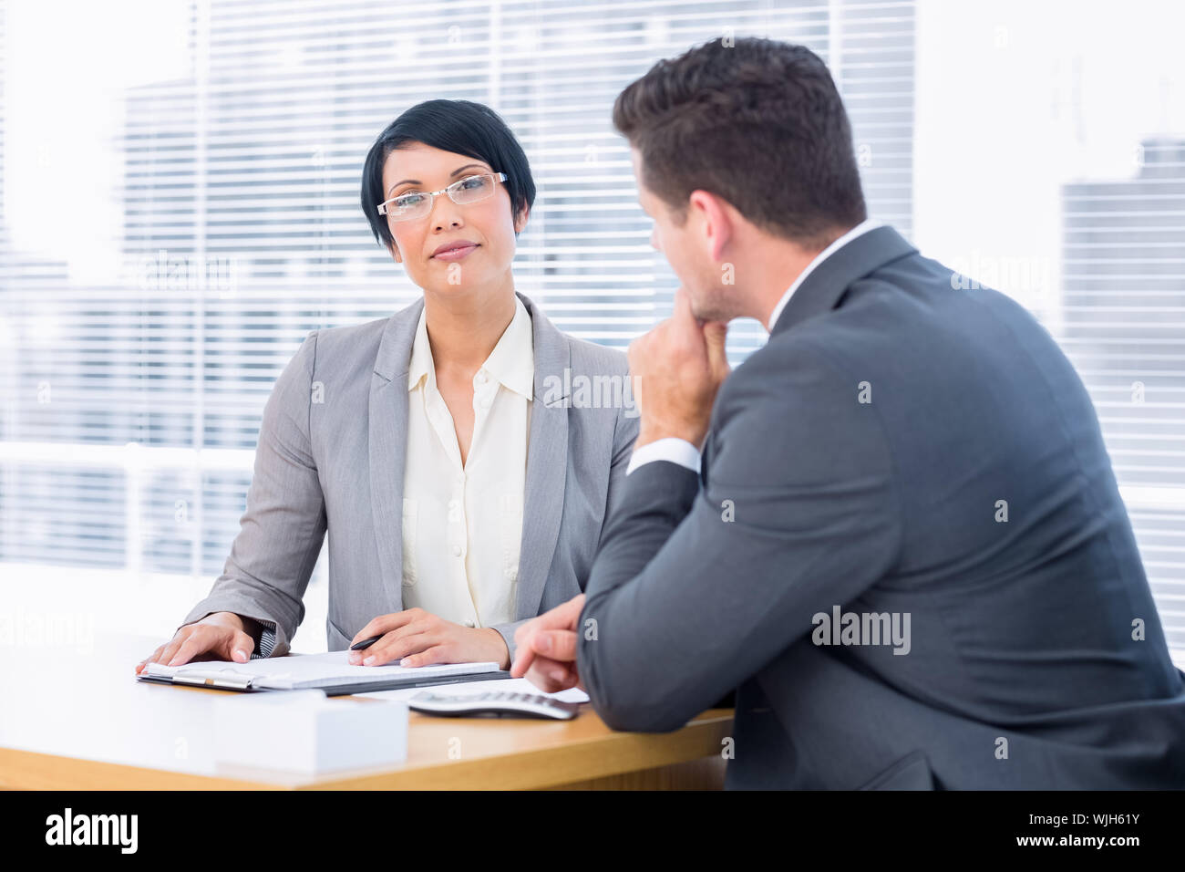 Smartly dressed business man at desk hi-res stock photography and ...