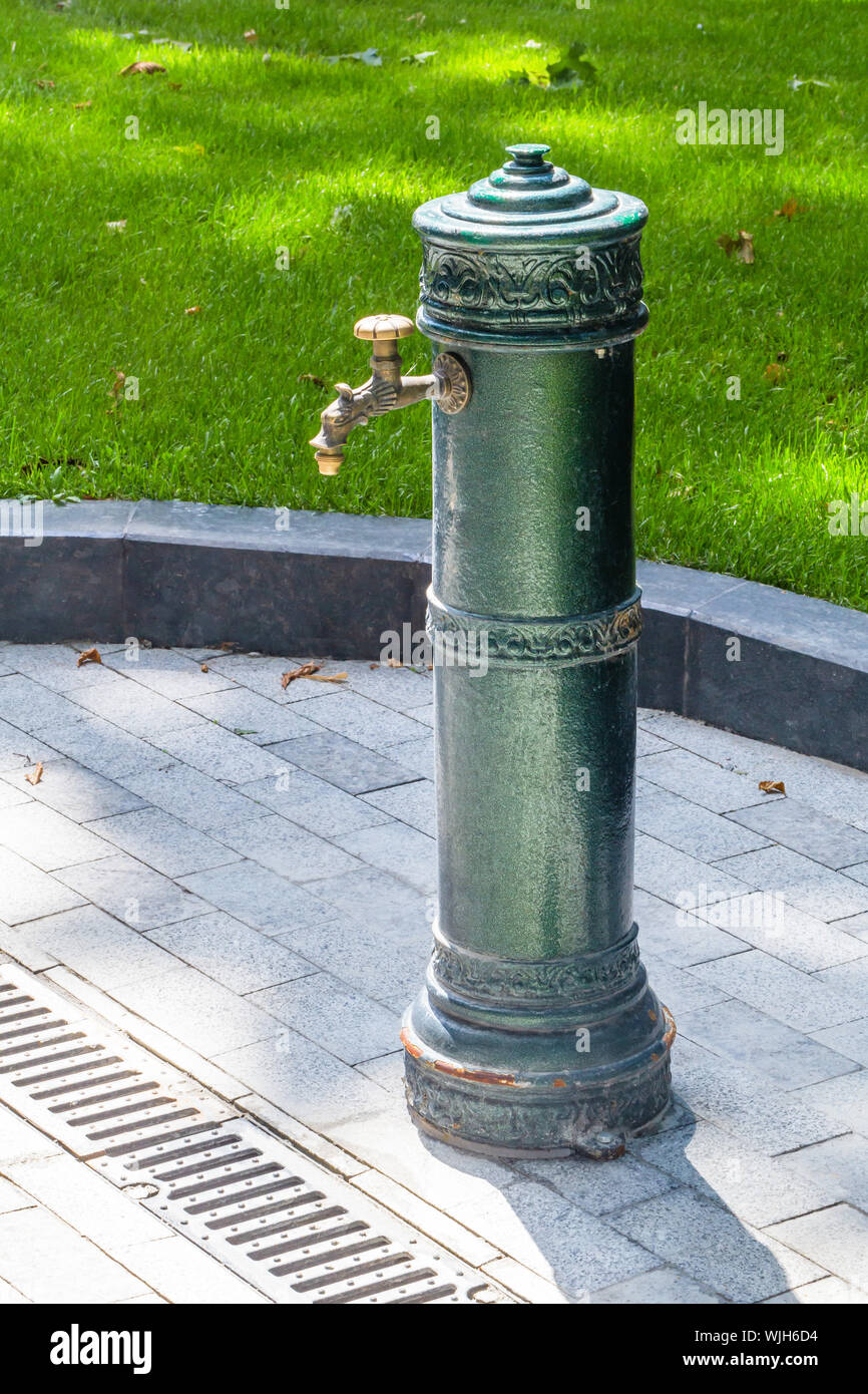 Vintage water free standpipe installed outdoors Stock Photo - Alamy