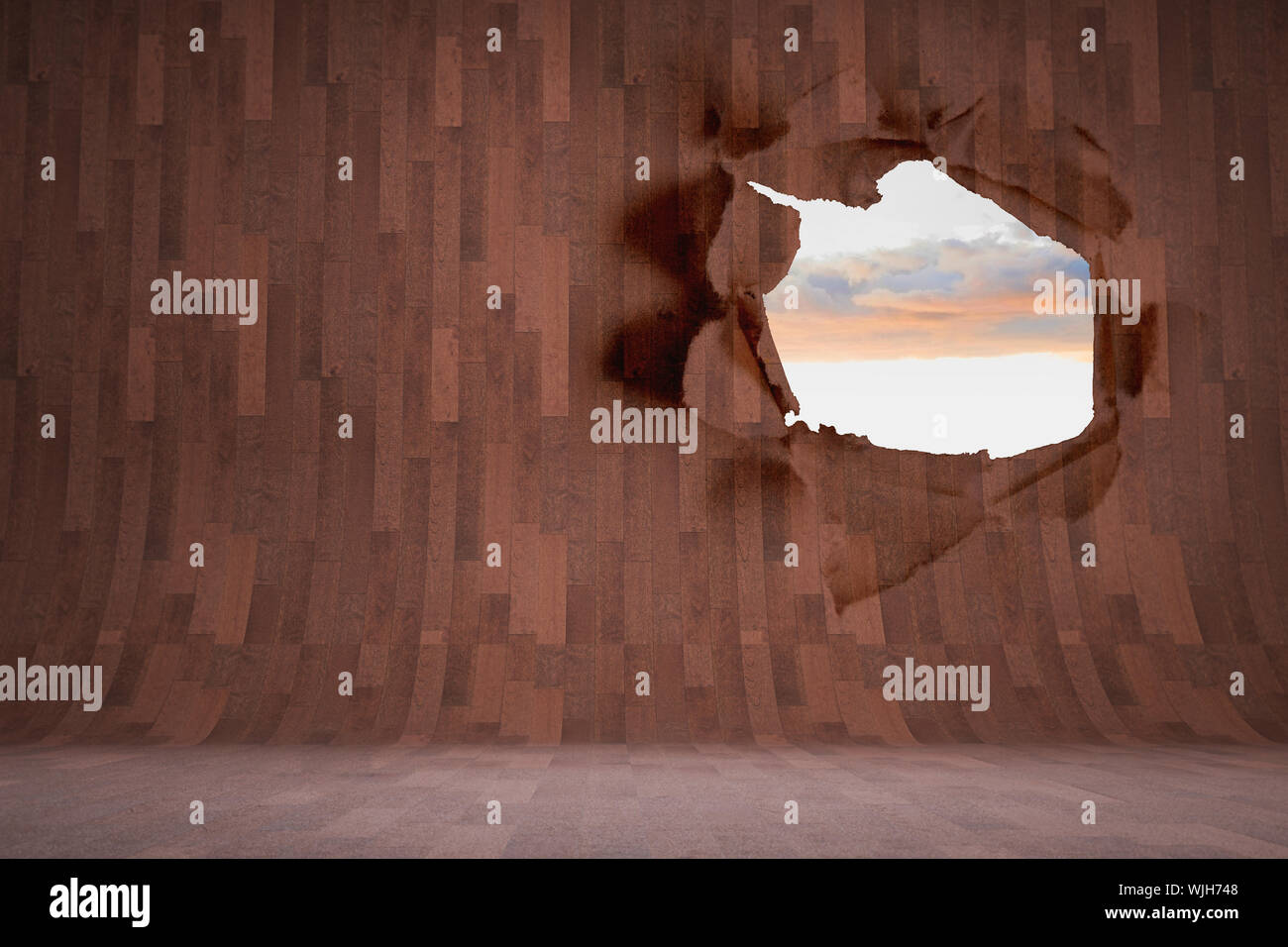 Rip on wall showing bright sky Stock Photo - Alamy