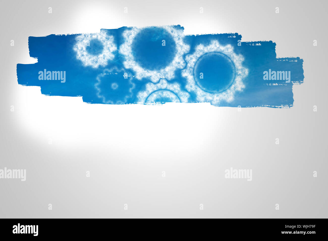Display on wall showing cog and wheel Stock Photo - Alamy