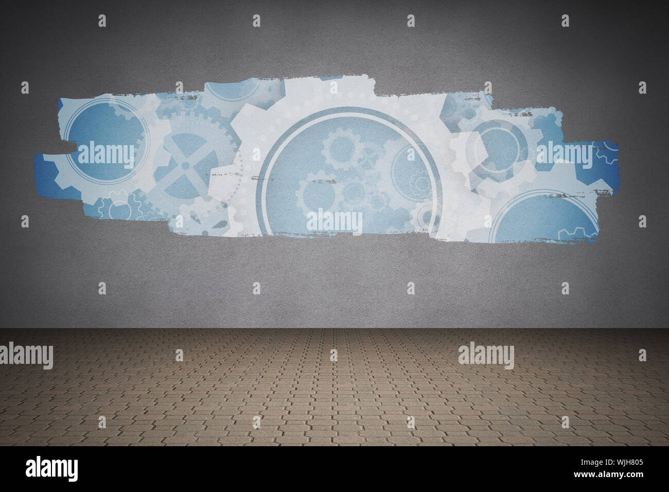 Display on wall showing cog and wheel Stock Photo - Alamy