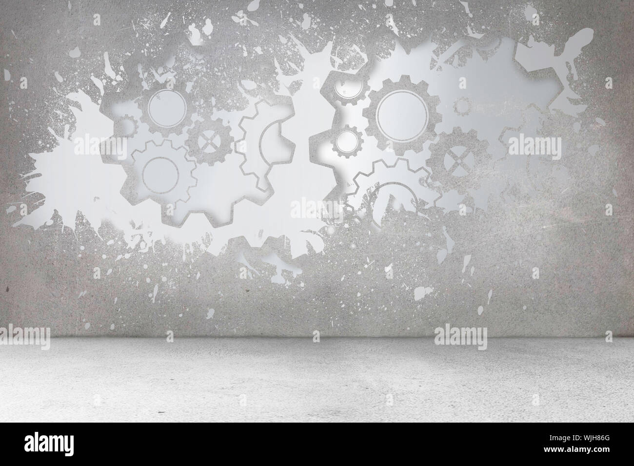 Splash on wall revealing cogs and wheels Stock Photo - Alamy